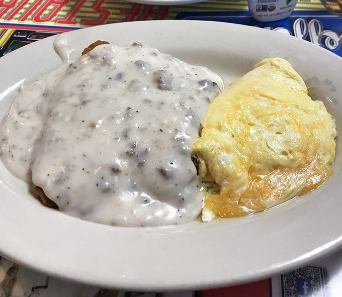 Country fried steak blanketed in peppery gravy alongside perfectly cooked eggs, breakfast doesn't get more satisfying than this.