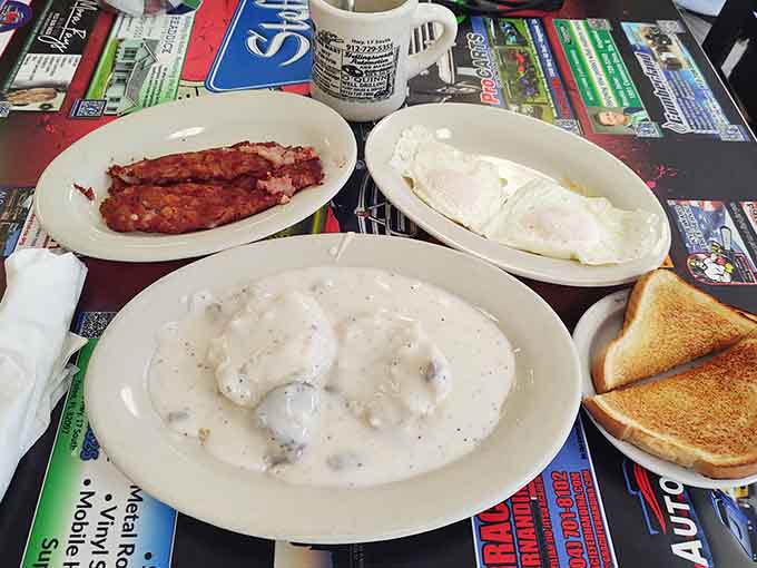 Country fried steak swimming in gravy, flanked by sides that understand the assignment perfectly.