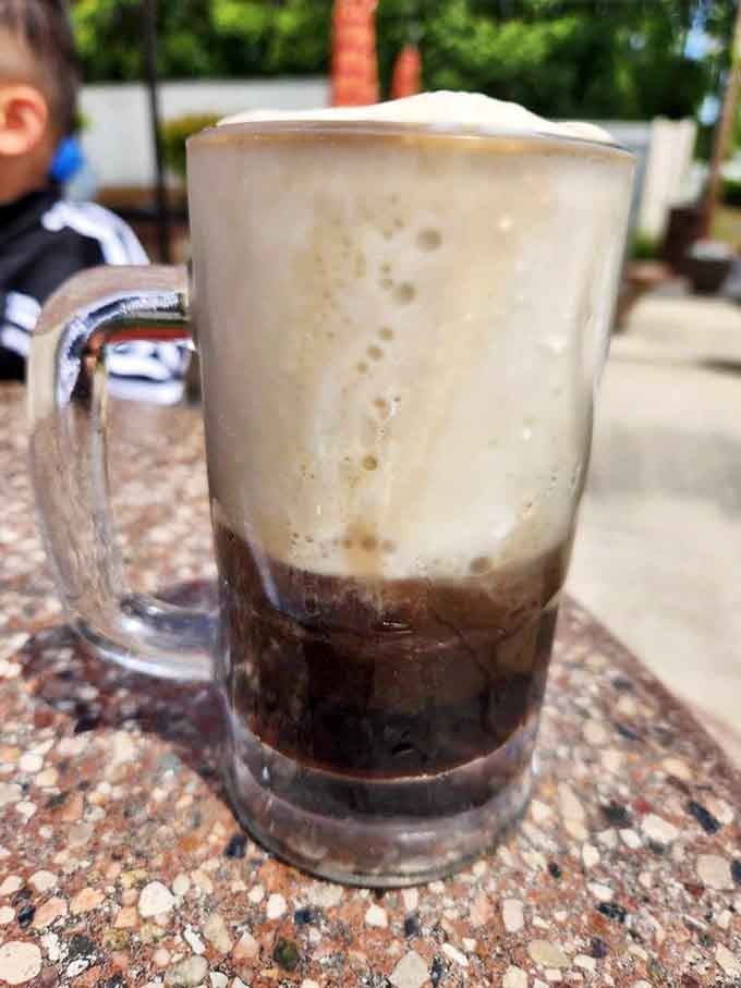 Root beer floats in frosted mugs are what happiness looks like when it's cold, creamy, and utterly irresistible.