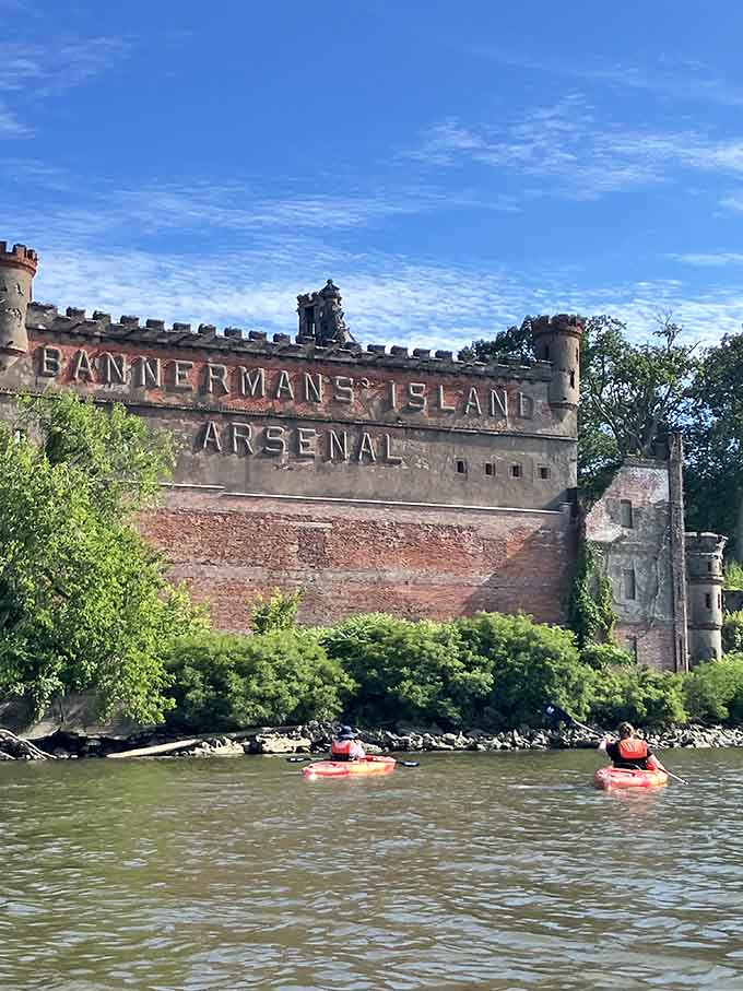 That "Bannerman's Island Arsenal" sign still advertises to passing boats, decades after the last customer paddled away.
