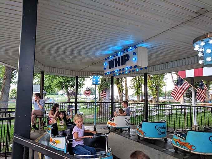 The Whip lives up to its name, spinning riders in a covered pavilion where laughter echoes off the ceiling.