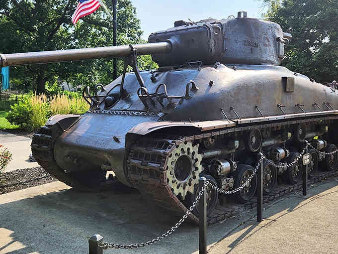 Nothing says "peaceful garden" quite like a World War II tank keeping watch over the flowers.