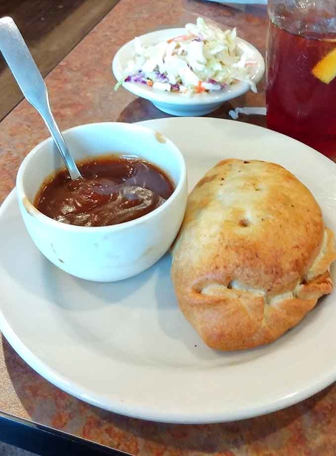 Rich gravy and crisp coleslaw turn a simple pasty into a complete meal worth the drive.