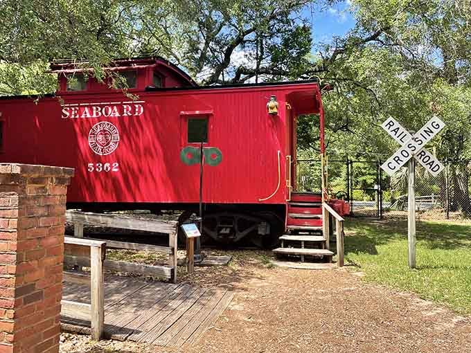 A bright red Seaboard caboose that's seen more of Florida than most residents ever will.