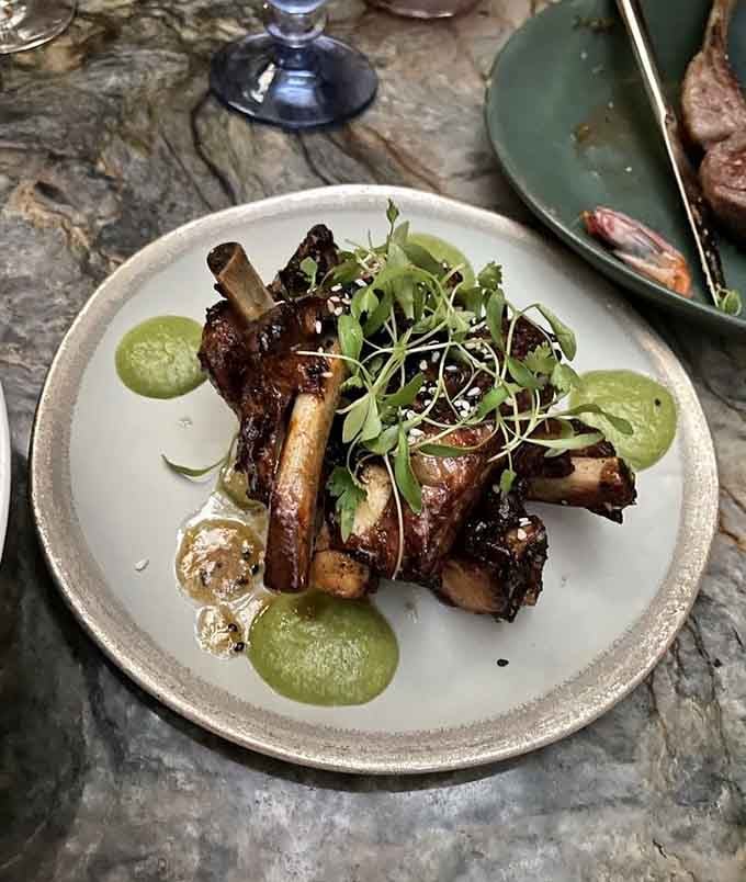 Miso-glazed pork ribs that fall off the bone, making chopsticks optional but napkins absolutely mandatory for this feast.