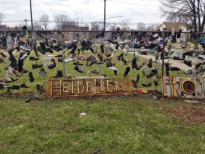 Shoes dangle like urban wind chimes, each pair representing journeys taken and stories left untold across Detroit's streets.