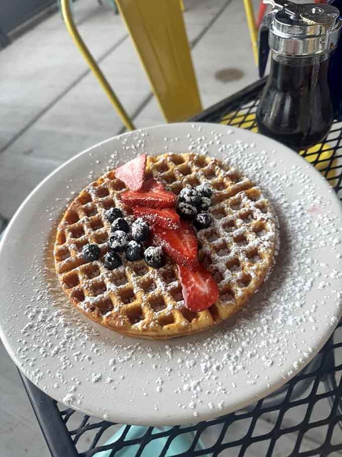 Belgian waffles adorned with fresh berries prove that sometimes the simple pleasures are the ones worth celebrating most loudly.
