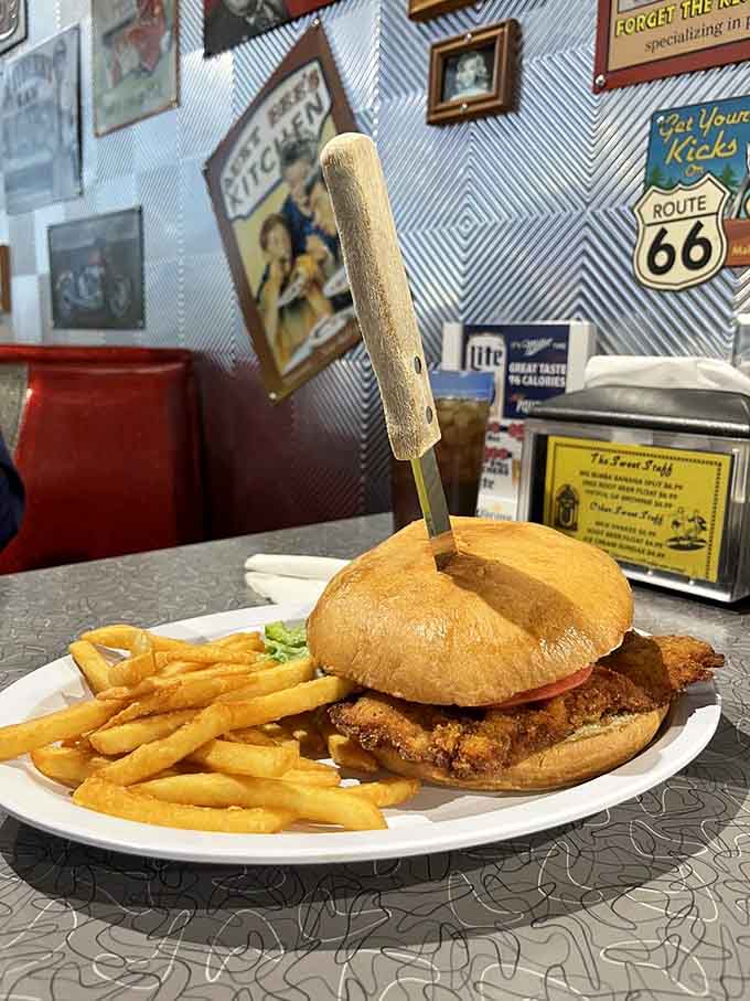 That breaded tenderloin stretches beyond the bun like Indiana's answer to culinary generosity and pride.