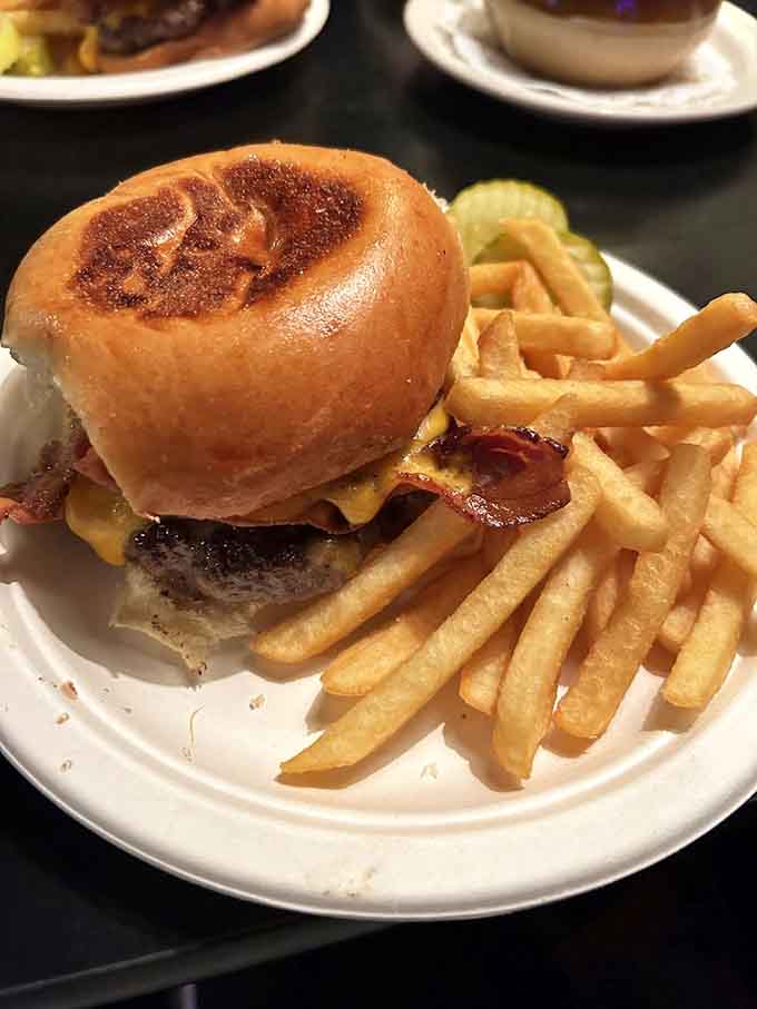 That burger sits there with bacon and cheese like it's daring you to contemplate anything other than pure deliciousness.