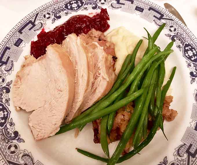 Sliced turkey with all the trimmings proves Thanksgiving doesn't need a calendar date, just a hungry appetite and good sense.
