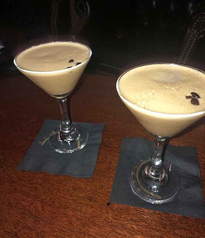 Coffee beans floating on creamy foam like tiny life rafts in the most delicious sea you'll ever navigate.