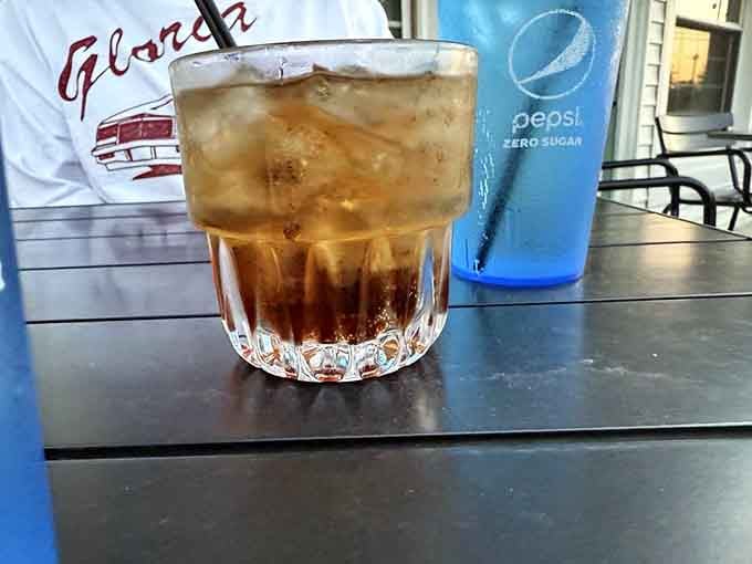 Sometimes the simplest drinks hit hardest: whiskey and Coke in a rocks glass, enjoyed where history happened one sip at a time.