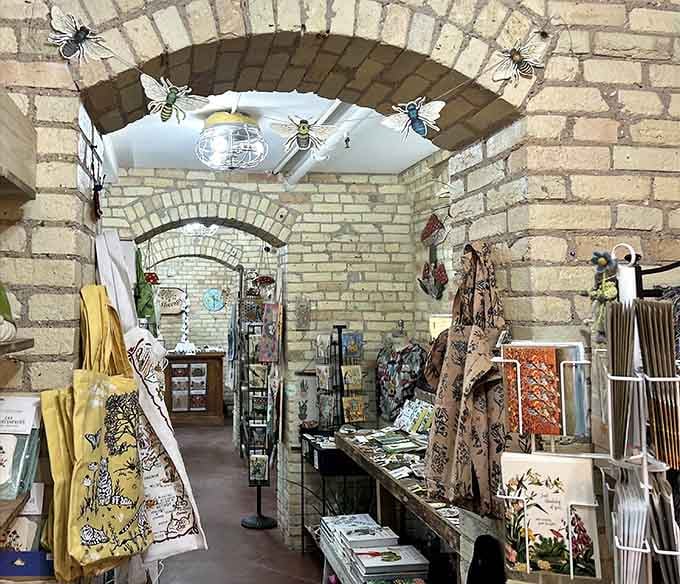 Those brick archways frame boutique shops where handcrafted treasures wait to jump into your shopping bag and come home.