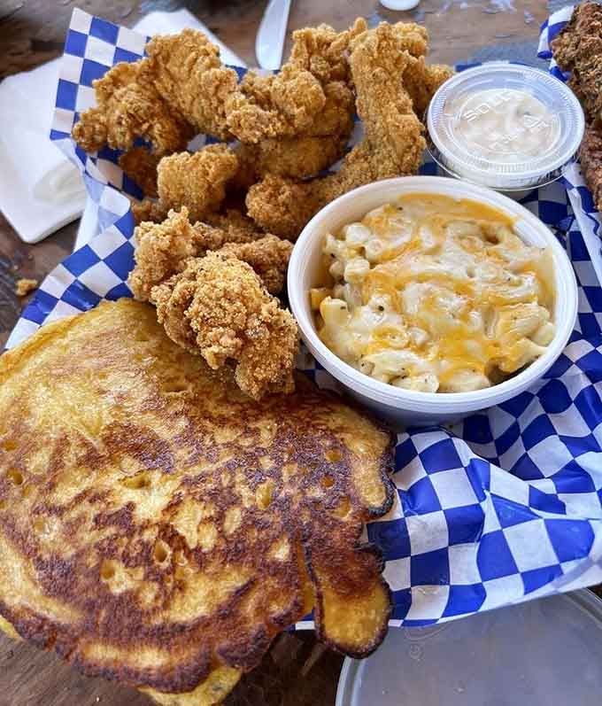 Fried catfish, mac and cheese, and cornbread create the holy trinity of Southern comfort on one plate.