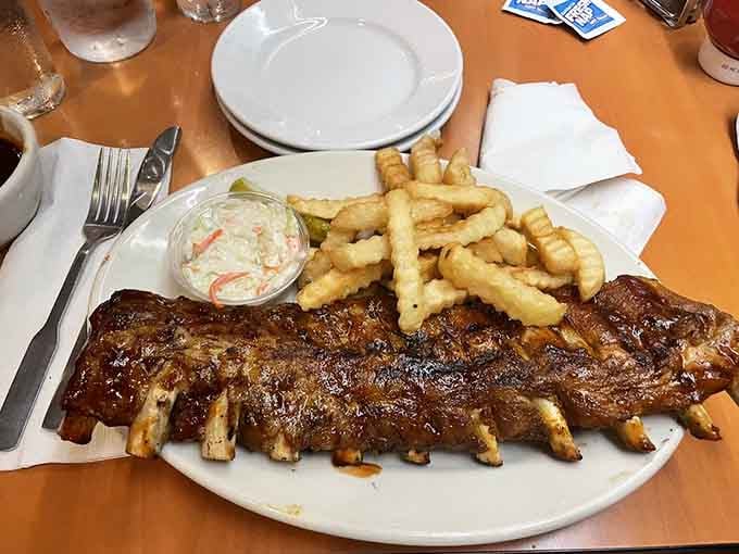 Those crinkle-cut fries and creamy coleslaw are the reliable friends your ribs bring to every delicious party.