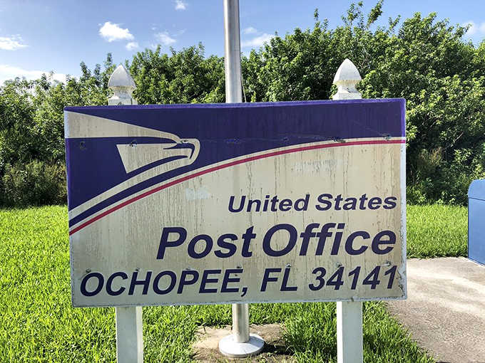 The official USPS sign confirms this adorable structure is indeed a fully functioning United States Post Office.