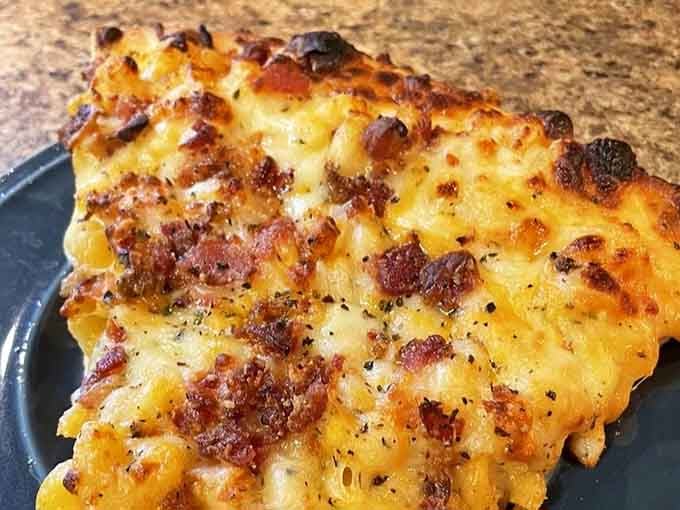 The Mac & Cheese pizza is what happens when comfort food has a midlife crisis and becomes absolutely glorious.