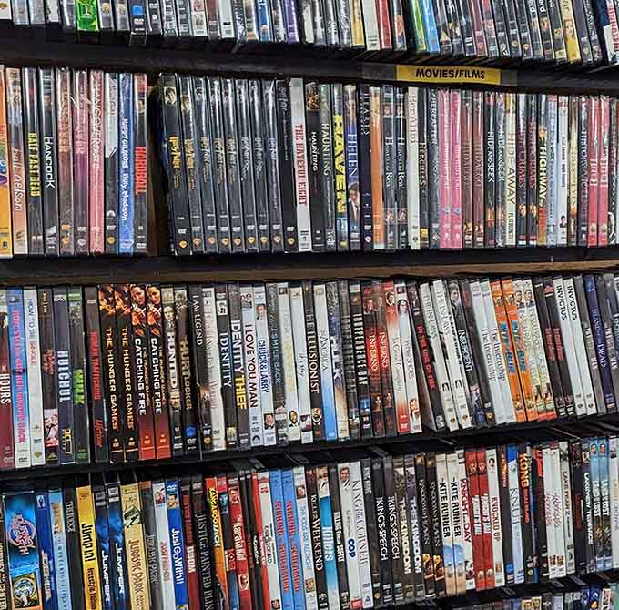 DVDs lined up like soldiers, ready to rescue you from another night of scrolling through streaming services.