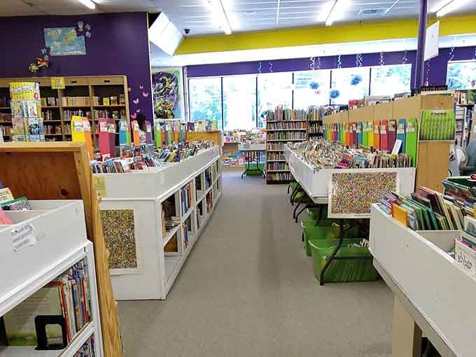 Purple walls and bright accents create a cheerful atmosphere where getting lost in the stacks is encouraged.