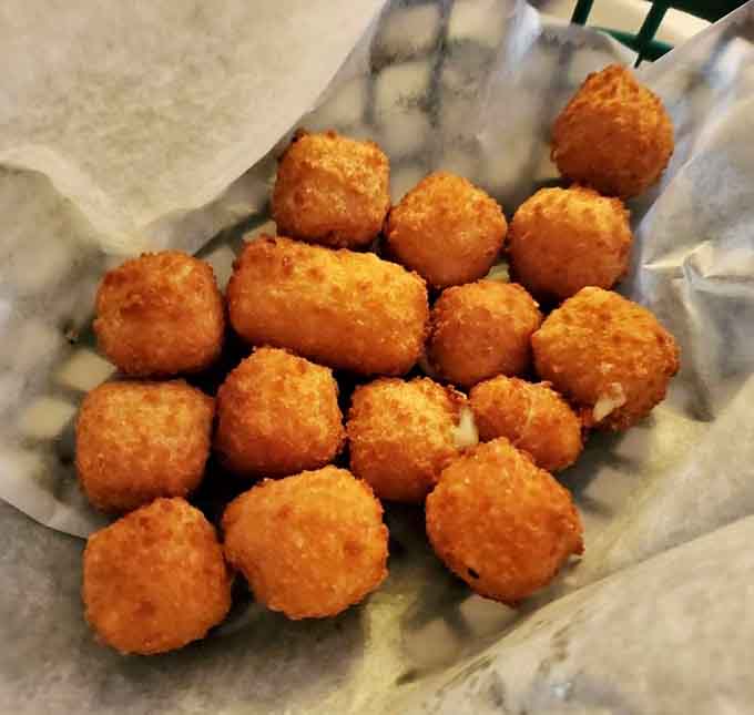 These golden cheese bites are basically little spheres of happiness, and yes, you'll want to order extra for the table.