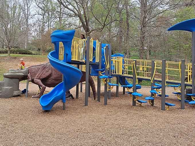 Those spiraling blue slides promise thrills that would make even the Flintstones jealous of modern playground engineering.