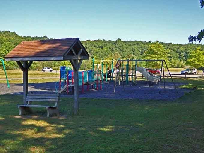 Even the playground gets a mountain backdrop here, making suburban swing sets look tragically underdressed by comparison.
