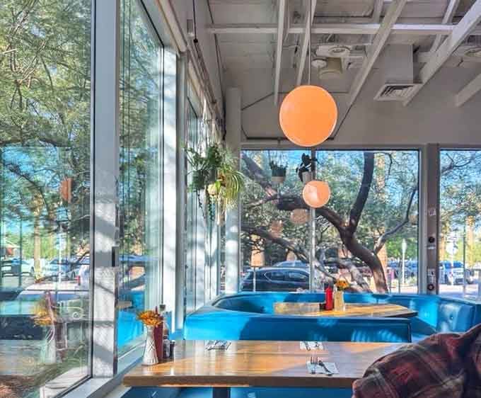 Natural light floods these booths, making every meal feel like a celebration even on a random Tuesday morning.
