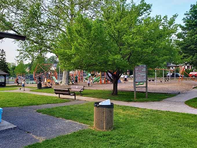 Lush green spaces surround the play area, offering room to run, picnic, and enjoy a proper outdoor family day.