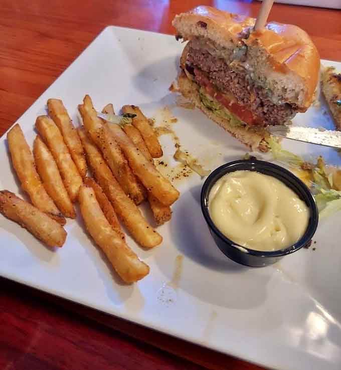 The Black & Bleu Burger arrives stacked tall, proving that good things come to those who bring their appetite.