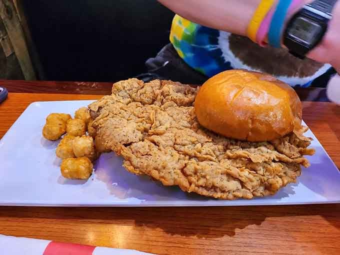 The bun looks adorably optimistic next to that massive tenderloin, like David meeting Goliath at a picnic.