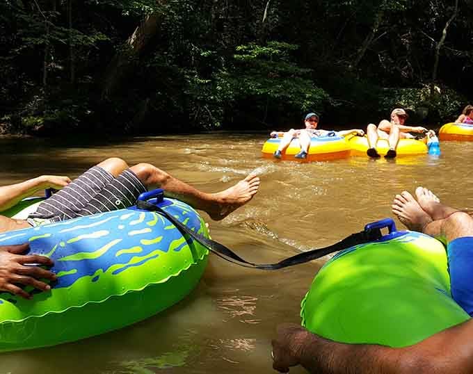 Pure joy captured mid-float: this is what happens when you trade your couch for a tube.