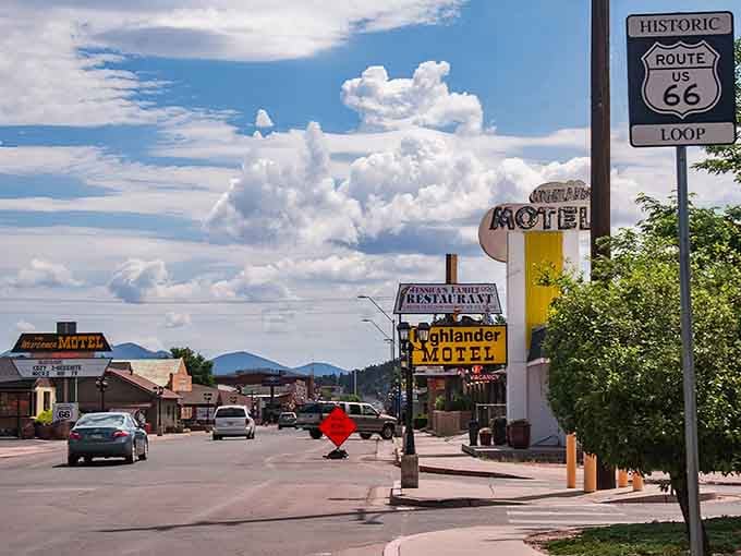 Route 66 stretches through town beneath mountain views that remind you why people fell in love with road trips.