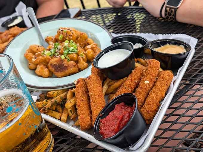 Golden mozzarella sticks and boom boom cauliflower sharing a platter like the best buddy comedy ever.