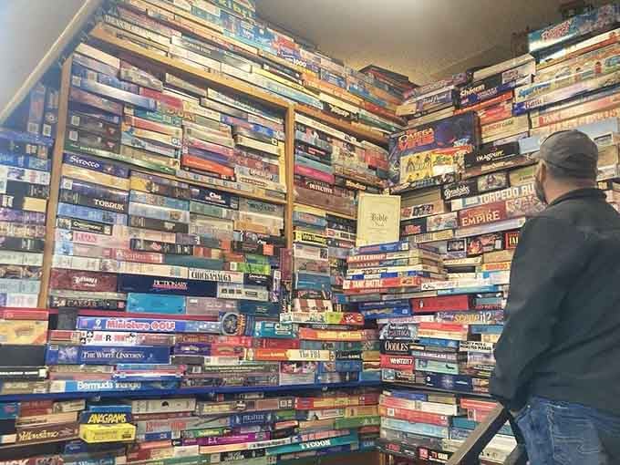 A wall of board games representing decades of family arguments, alliances, and someone always flipping the table.