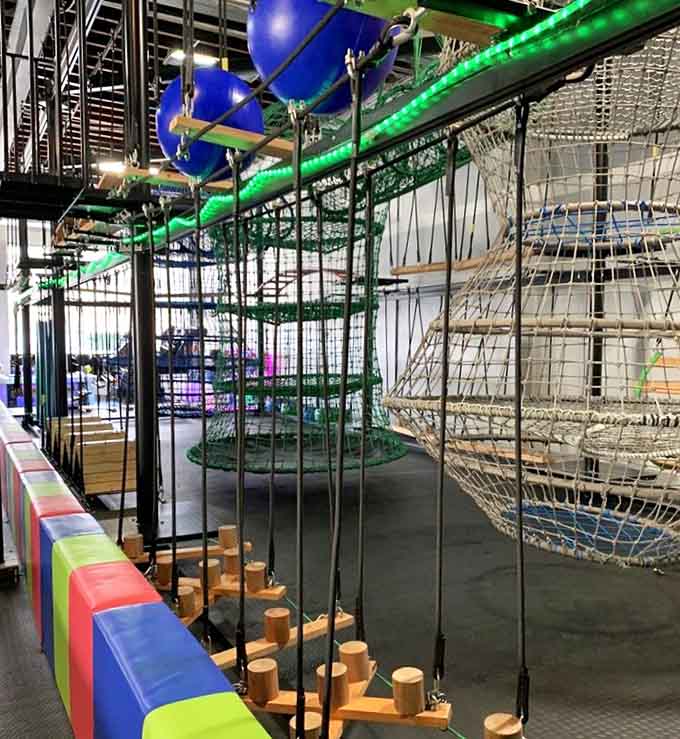 Suspended obstacles and dangling challenges turn ordinary kids into determined athletes conquering their personal Everest one grip at a time.