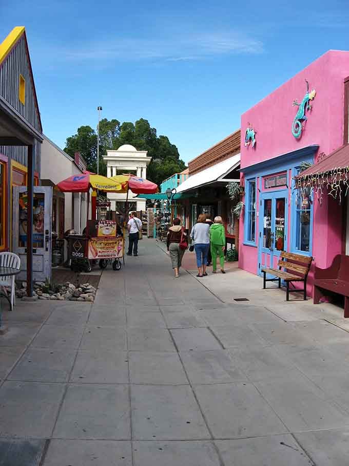 Colorful storefronts pop against blue skies, proving that shopping can be an adventure, not just an errand.