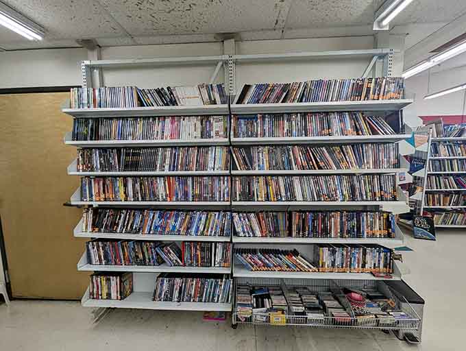 DVDs and media line up like a video store time capsule, ready to rebuild your collection affordably.