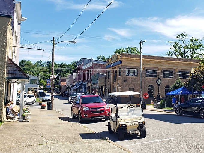 A golf cart cruising Main Street perfectly captures the relaxed pace where neighbors still wave to passing friends.