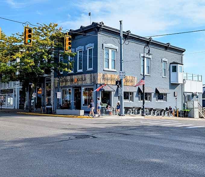 Weathered storefronts painted in soft blues tell stories of fishing families and lake life that span multiple generations here.