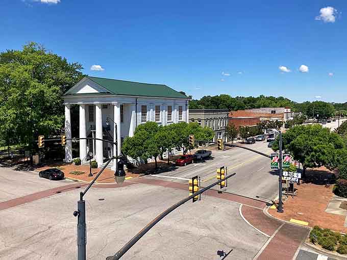 That white-columned building stands guard over downtown like a Southern gentleman who's seen generations come and go.