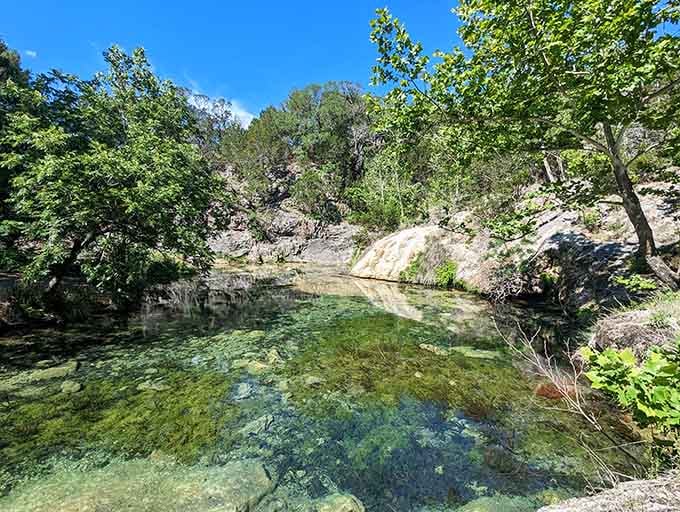 Hidden pools of emerald water nestled in limestone embrace nature's own private swimming hole perfectly.