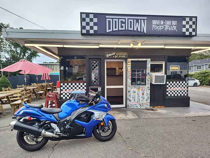Checkered racing vibes and a bright blue motorcycle signal fun times ahead&mdash;this spot takes hot dogs seriously without taking itself seriously.