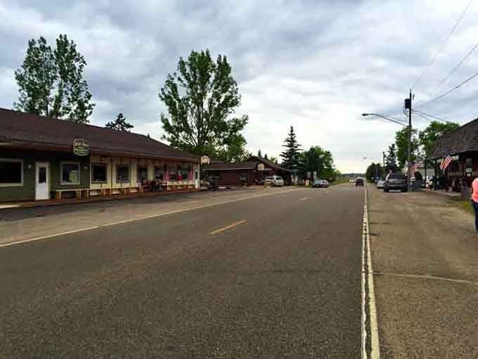 This quiet main street stretches toward distant trees, inviting you to slow down and remember what peaceful actually feels like.
