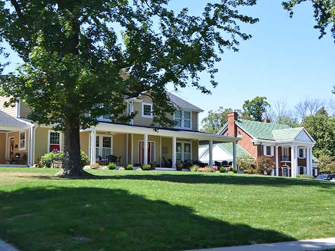 Manicured lawns and stately porches suggest a neighborhood where people still take pride in their homes and wave to passing neighbors.