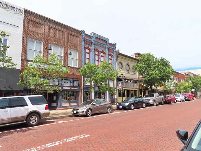 Brick pavement and leafy trees transform this downtown into an inviting outdoor living room.