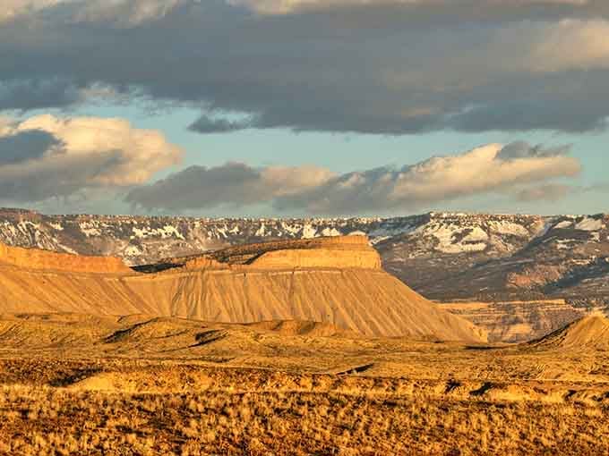 Golden hour transforms this flat-topped mesa into a glowing masterpiece that looks like it belongs in a Western movie.