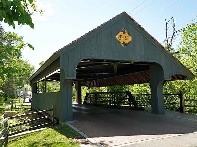 That blue-gray color makes this bridge stand out like a sapphire in a jewelry box of greenery.