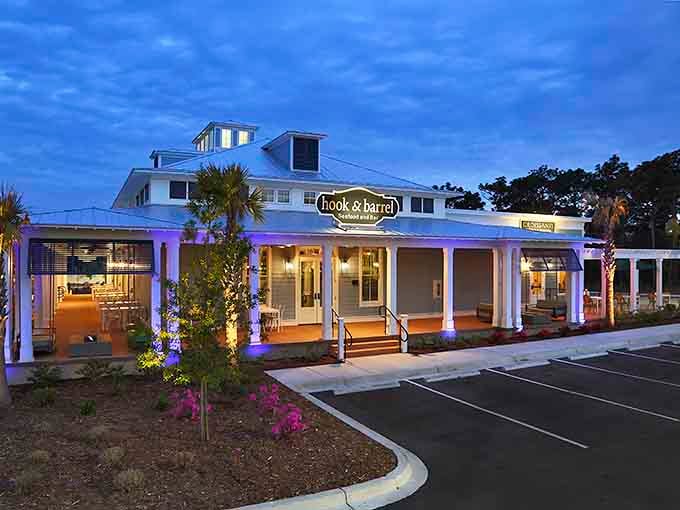 Evening lights transform this modern coastal building into a glowing beacon for seafood lovers everywhere.