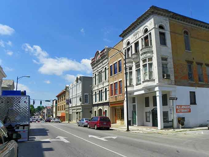 Those ornate upper windows catch the sunlight like architectural jewelry adorning the town's best-dressed buildings.