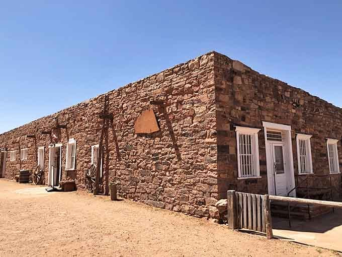 Hand-cut stone blocks form walls that have witnessed over a century of trade, conversation, and cultural exchange in the high desert.